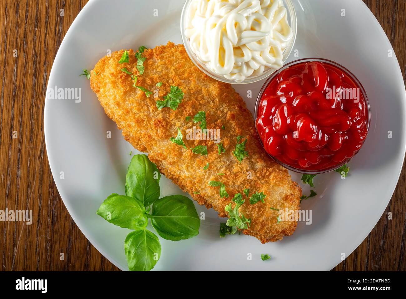Fried fish with ketchup and mayonnaise sauce - top view Stock Photo - Alamy