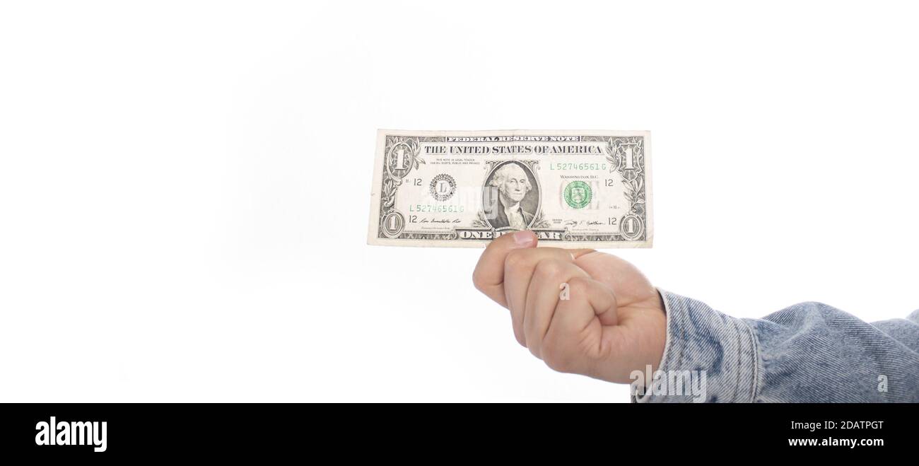 Closeup of the hand of a man holding a dollar bill in front of a white ...