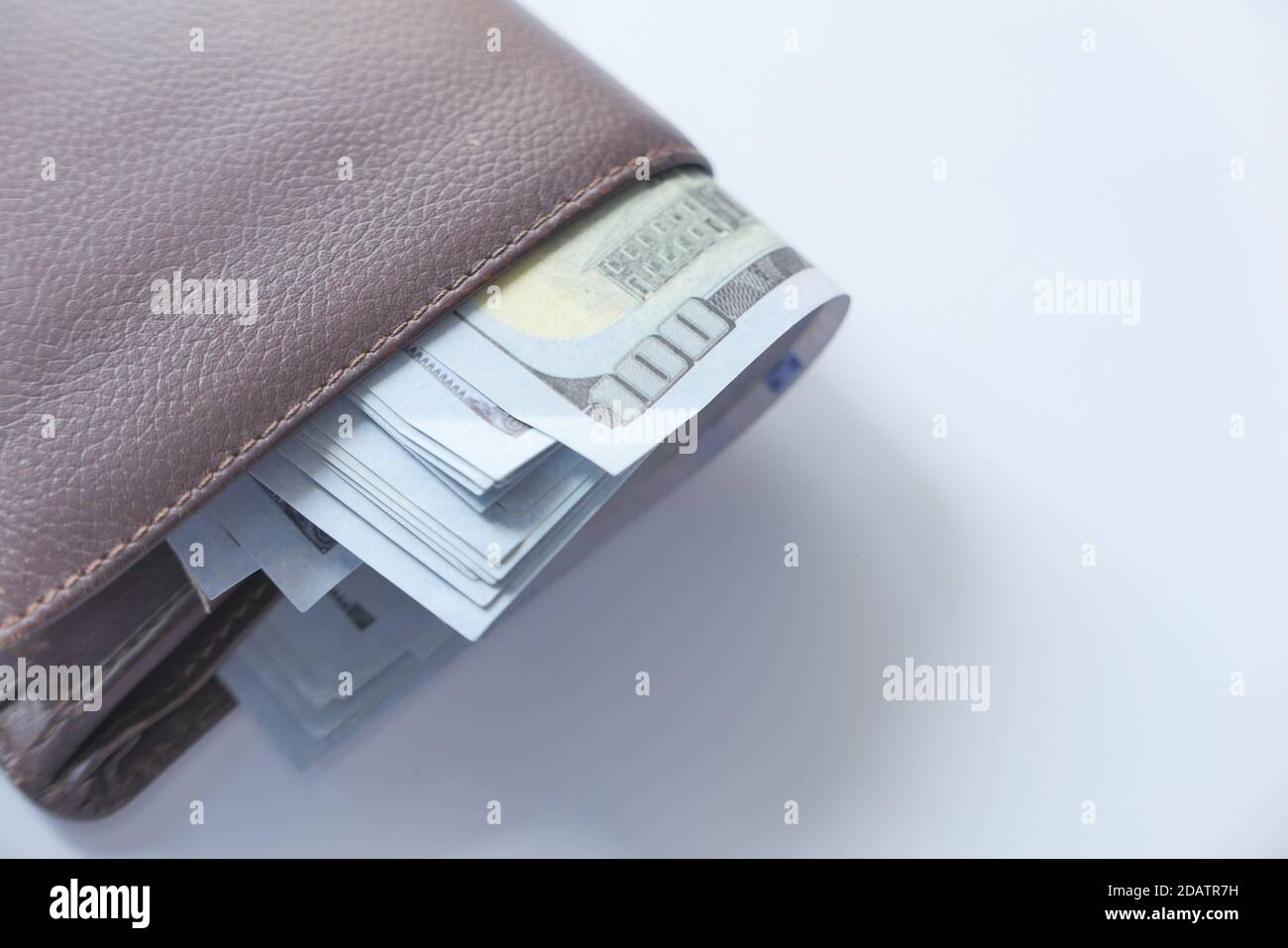 Close up of cash in wallet on table Stock Photo - Alamy