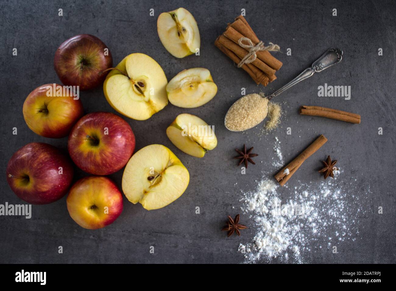 Apple pie preparation. Fresh apples, dough in baking form, cinnamon ...