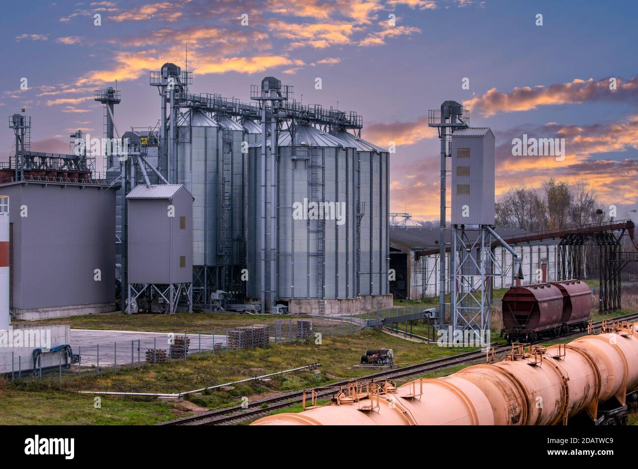 Grain silo, warehouse or depository next to railroad tracks Stock Photo ...