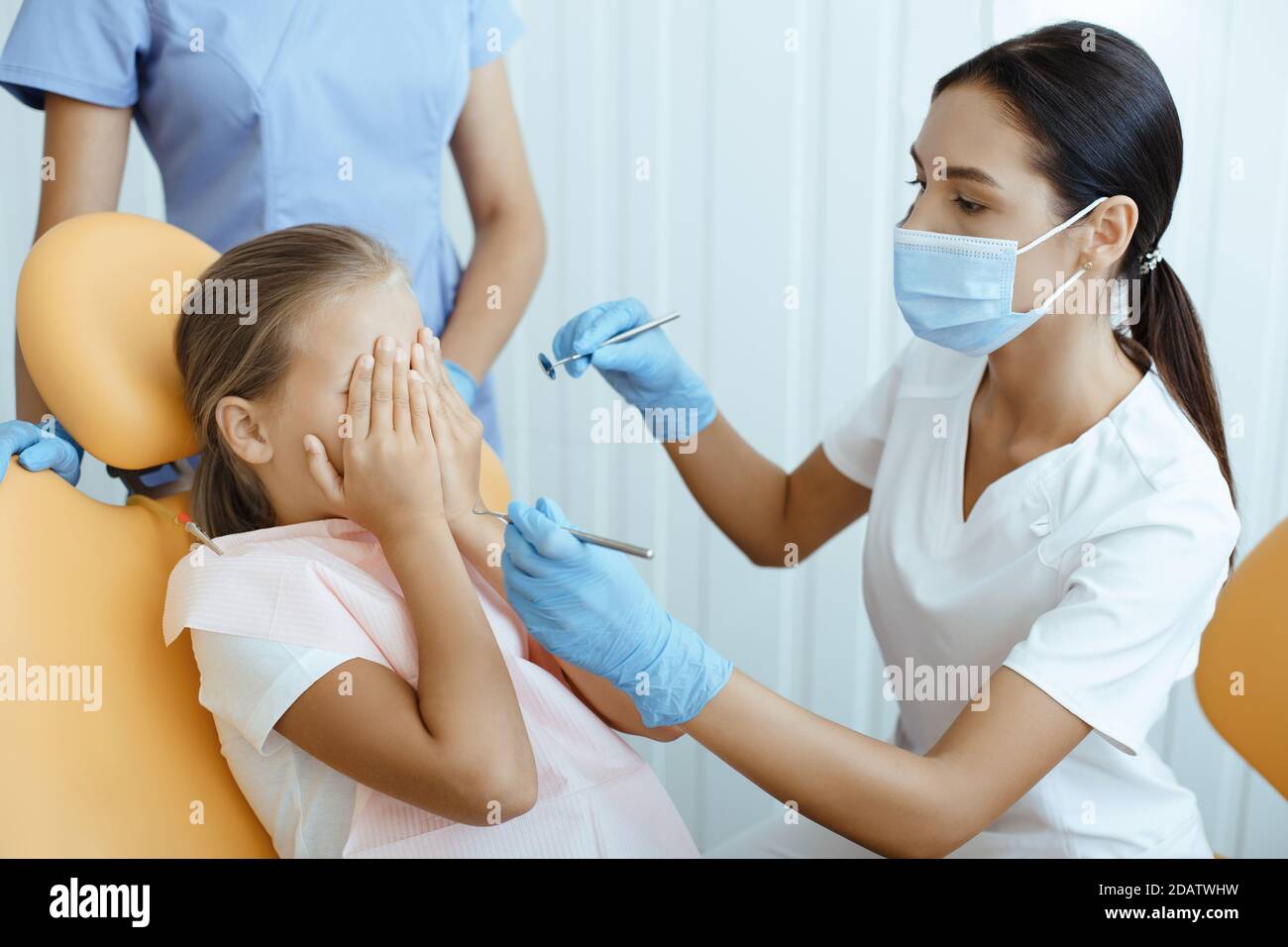 Cowardly child expresses emotions of fear of dental treatment Stock ...