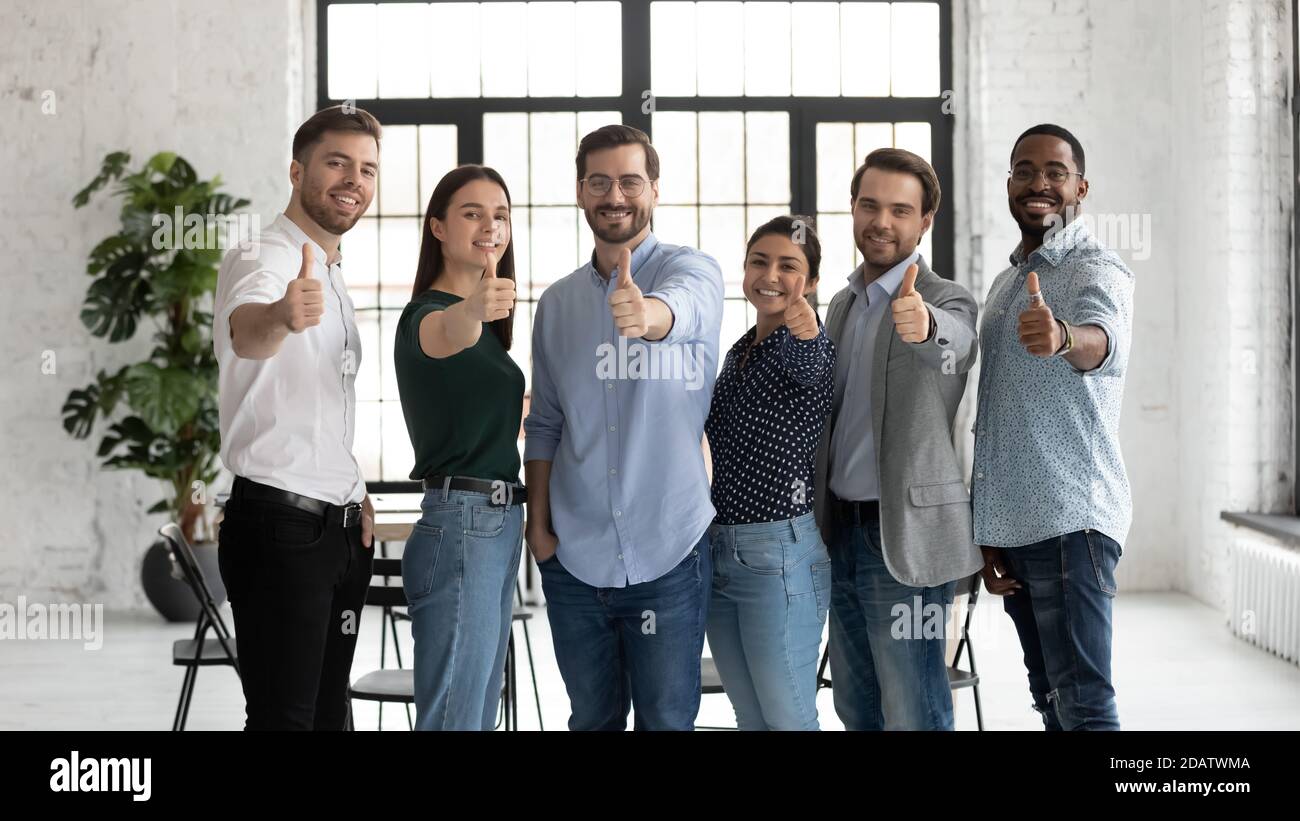 Multiethnic young people customers standing in line demonstrating ...