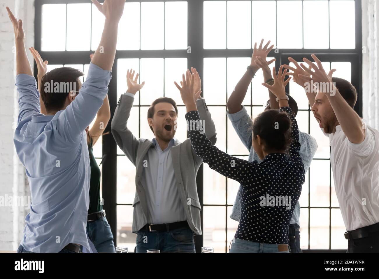 Active inspired diverse millennial staff members meeting on motivation ...