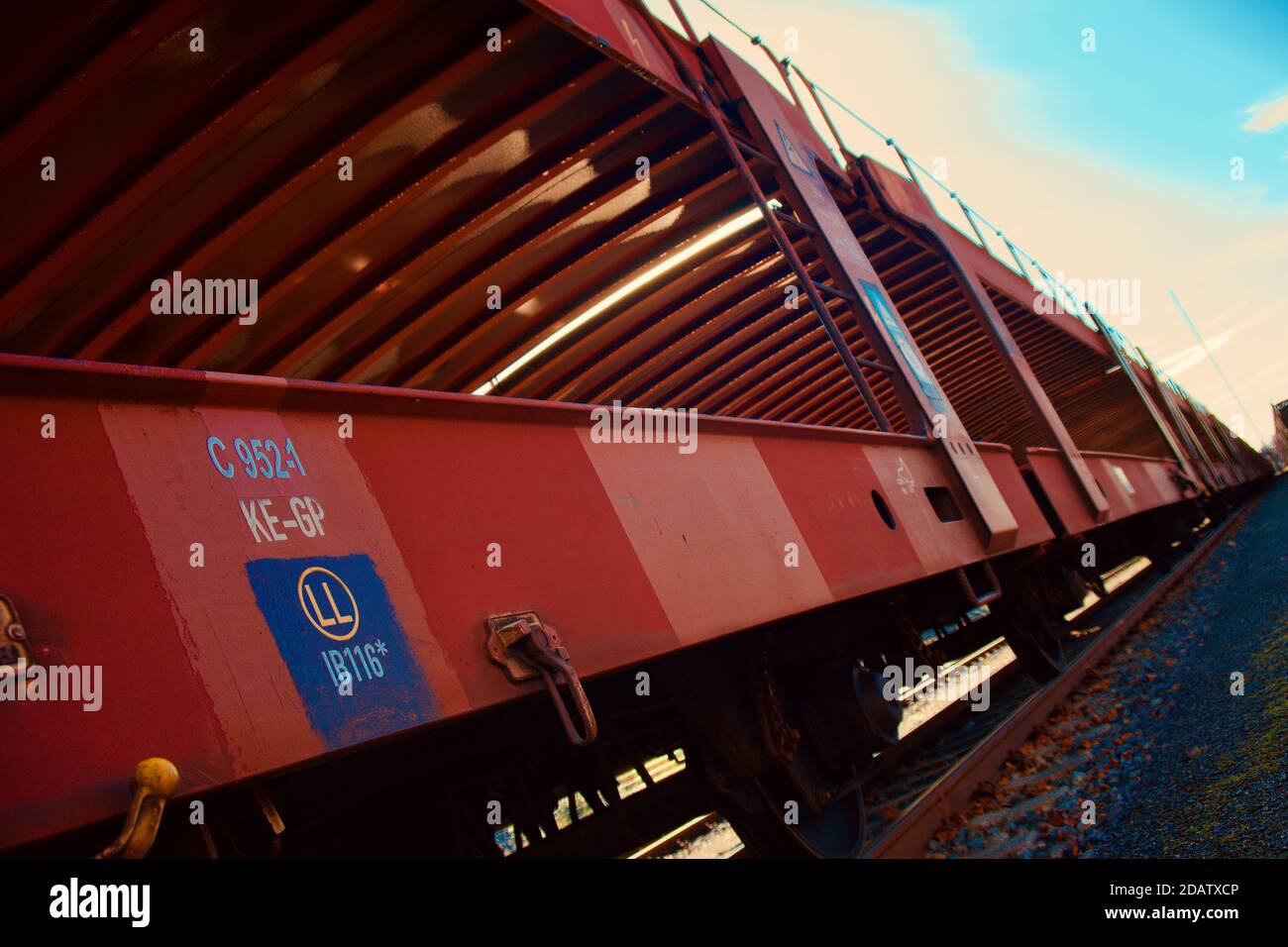Empty goods train waiting to be loaded with cars Stock Photo - Alamy