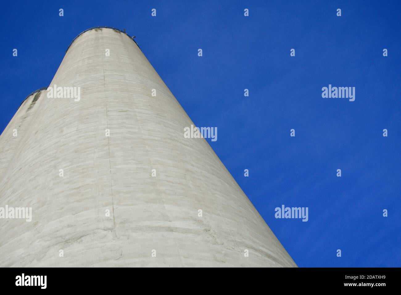 High concrete towers of an industrial plant Stock Photo - Alamy
