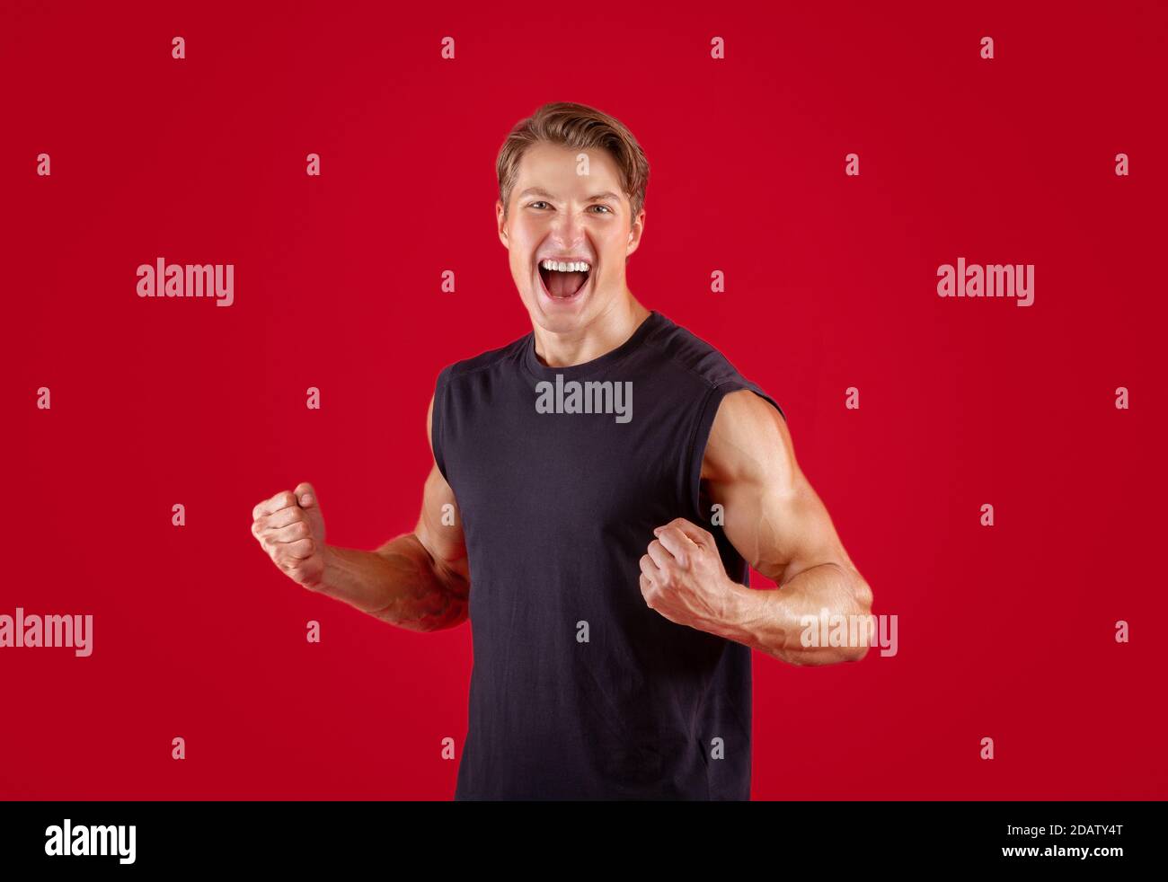 Emotional Caucasian sportsman screaming, making YES gesture ...