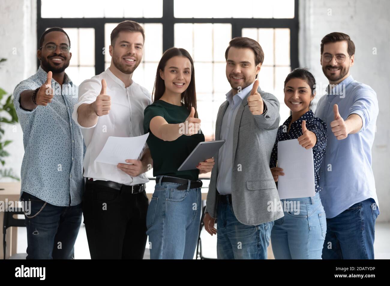 Team happy employees raising hi-res stock photography and images - Alamy