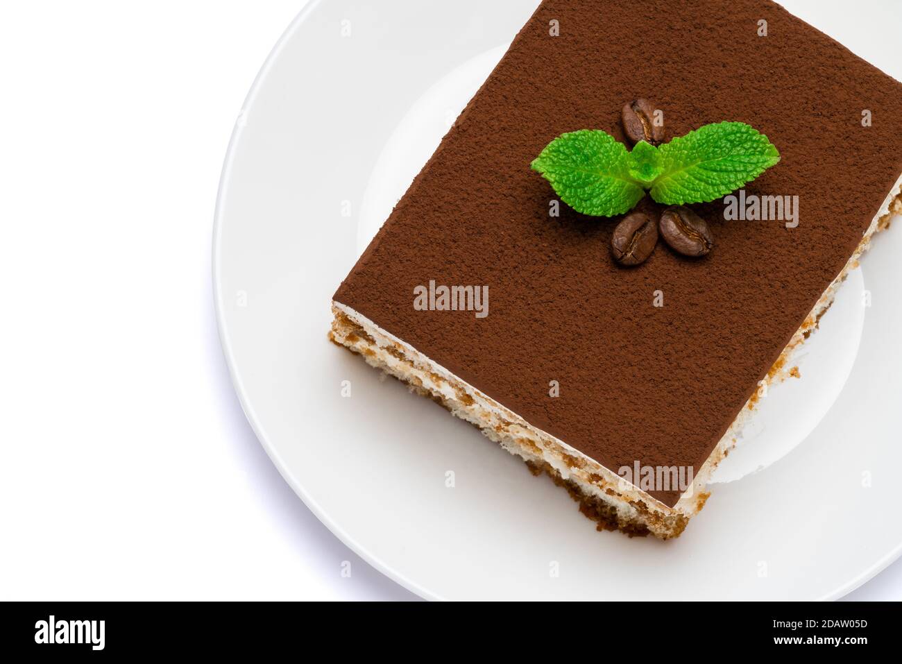 Traditional Italian Tiramisu square dessert portion on ceramic plate ...