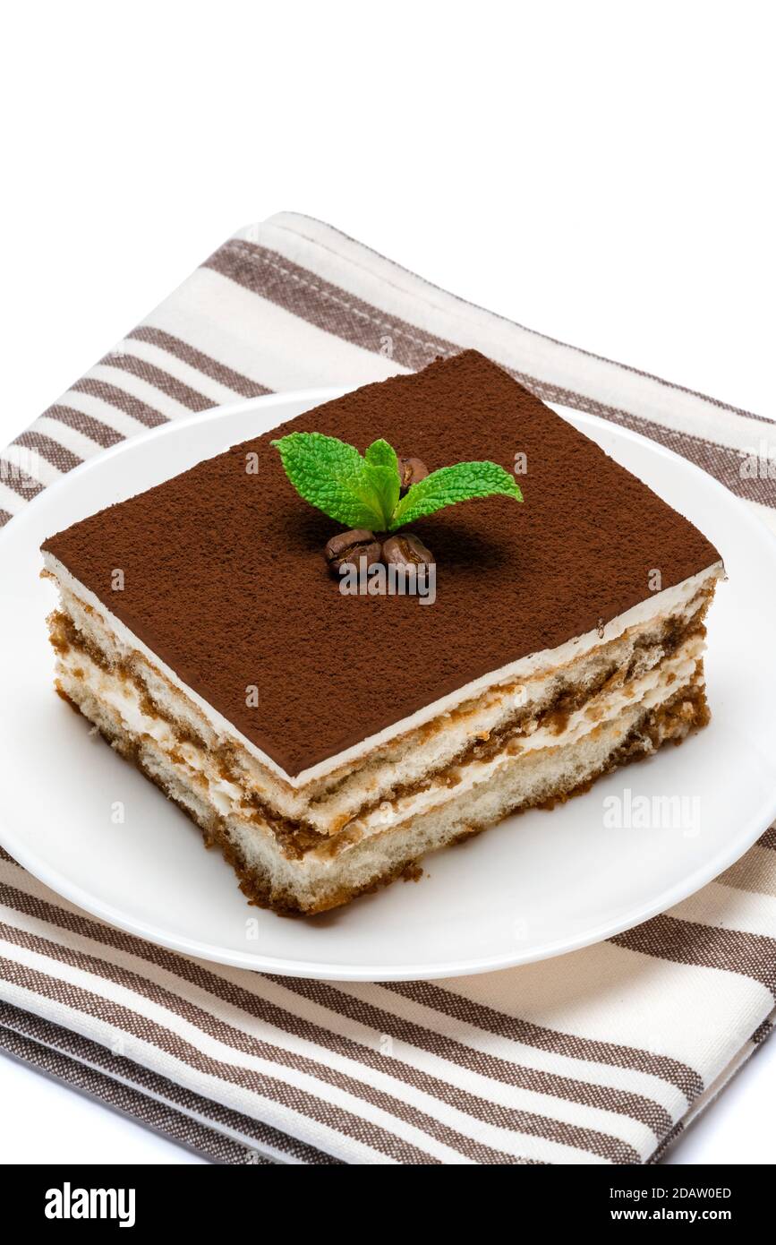 Traditional Italian Tiramisu square dessert portion on ceramic plate ...