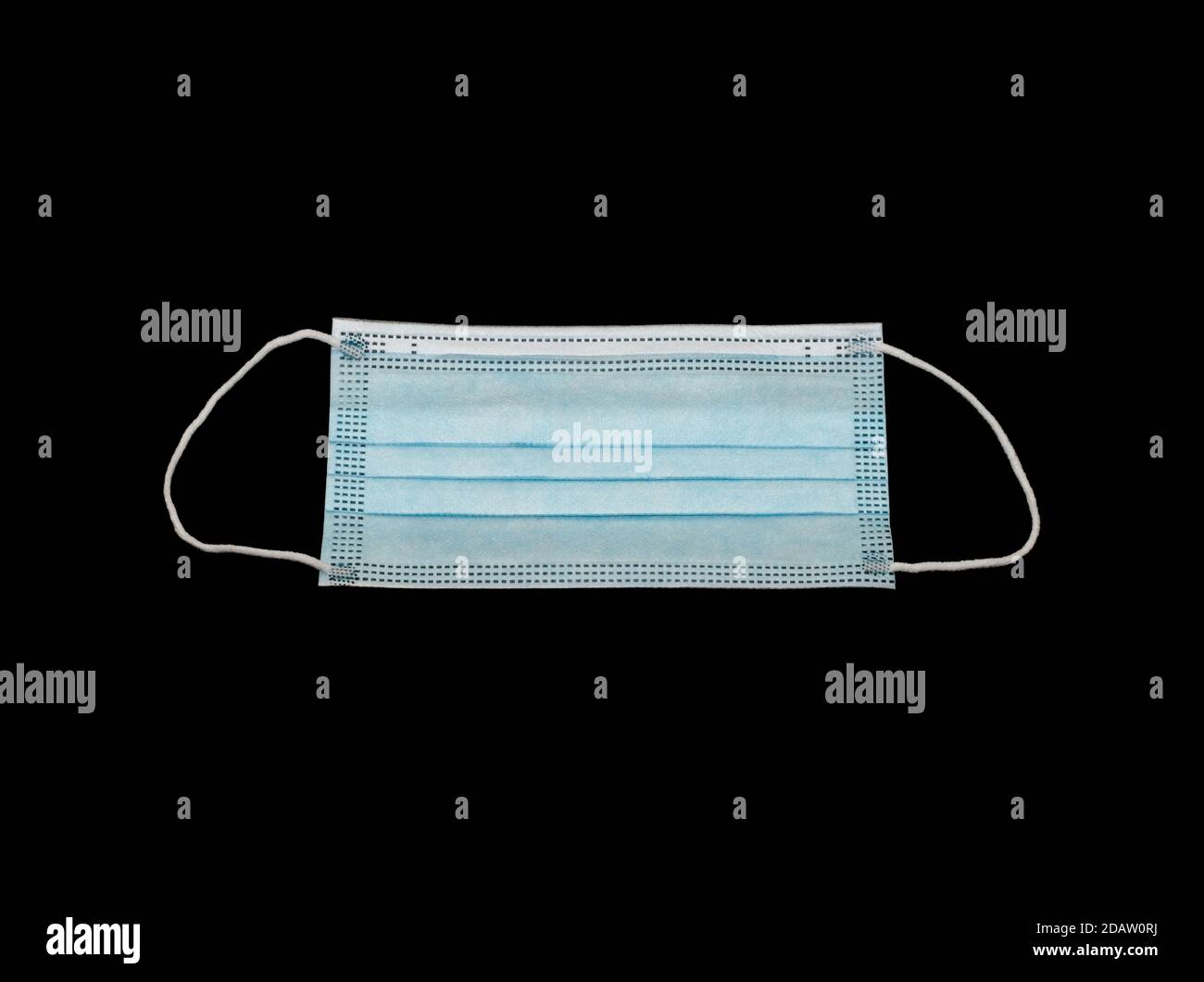 Blue Medical Face Mask Isolated on Black Stock Photo - Alamy