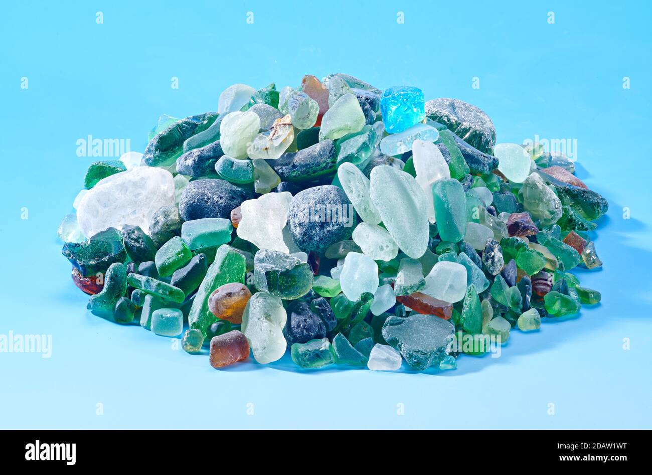 Group of glass stones of all sizes and colors, on a white background ...