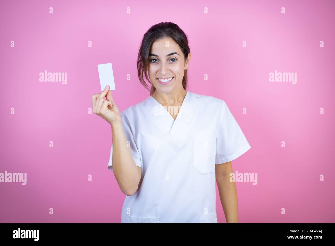 Young brunette doctor girl wearing nurse or surgeon uniform over ...