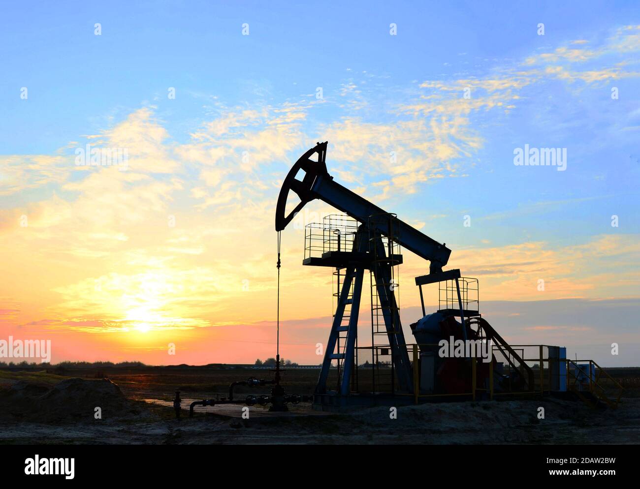 Oil drilling derricks at desert oilfield for fossil fuels output and ...