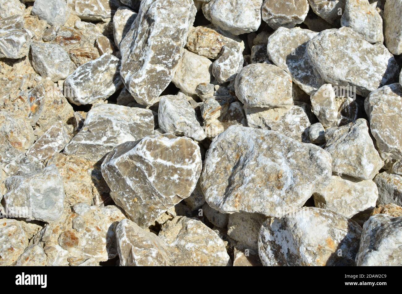 Natural gray gypsum stone. Close up image of stones with black and ...