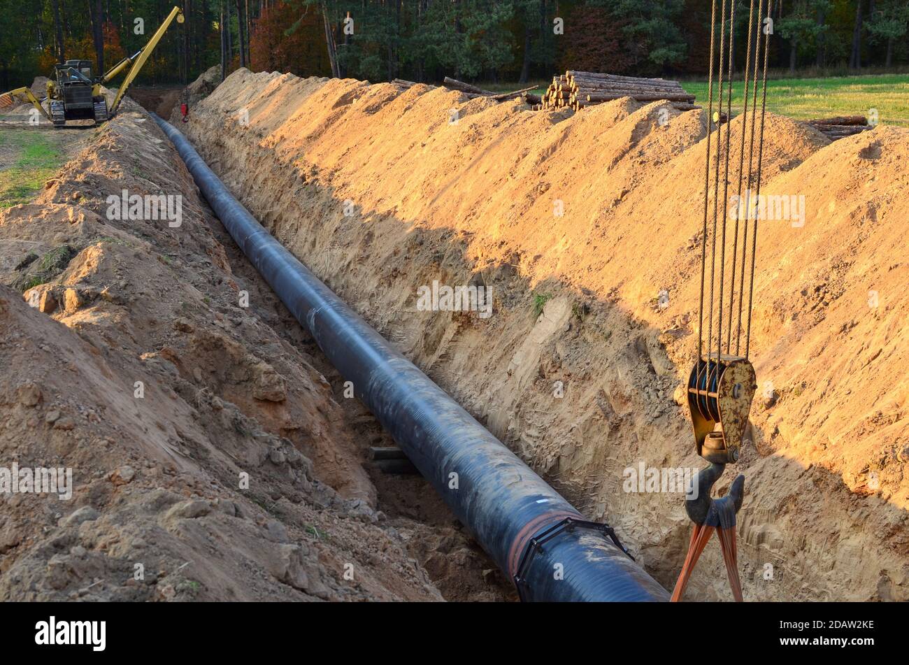 Natural gas pipeline construction work. A dug trench in the ground for ...
