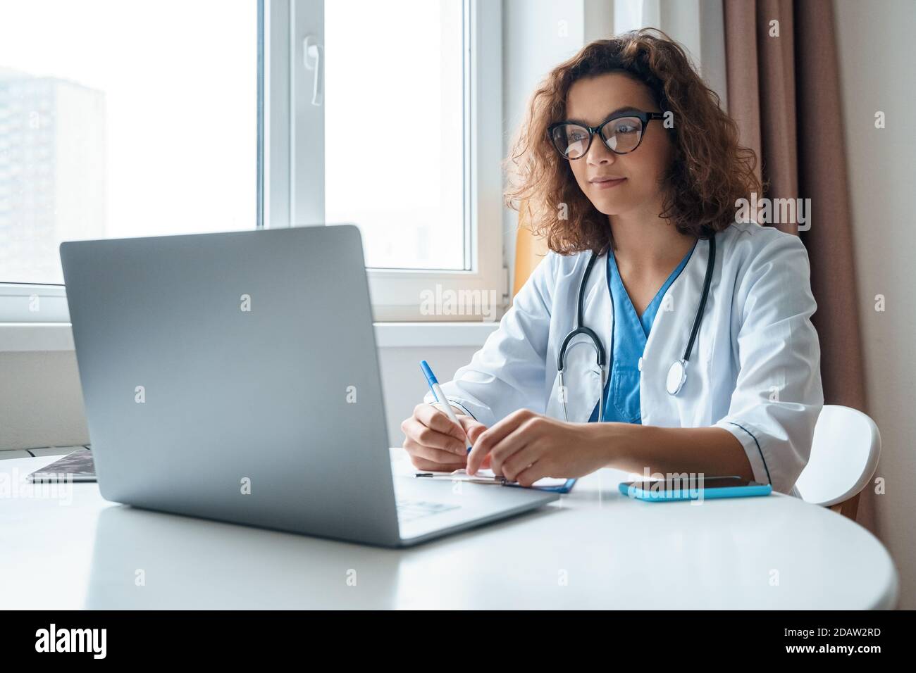 Female doctor wear white medical robe make online video call consult ...