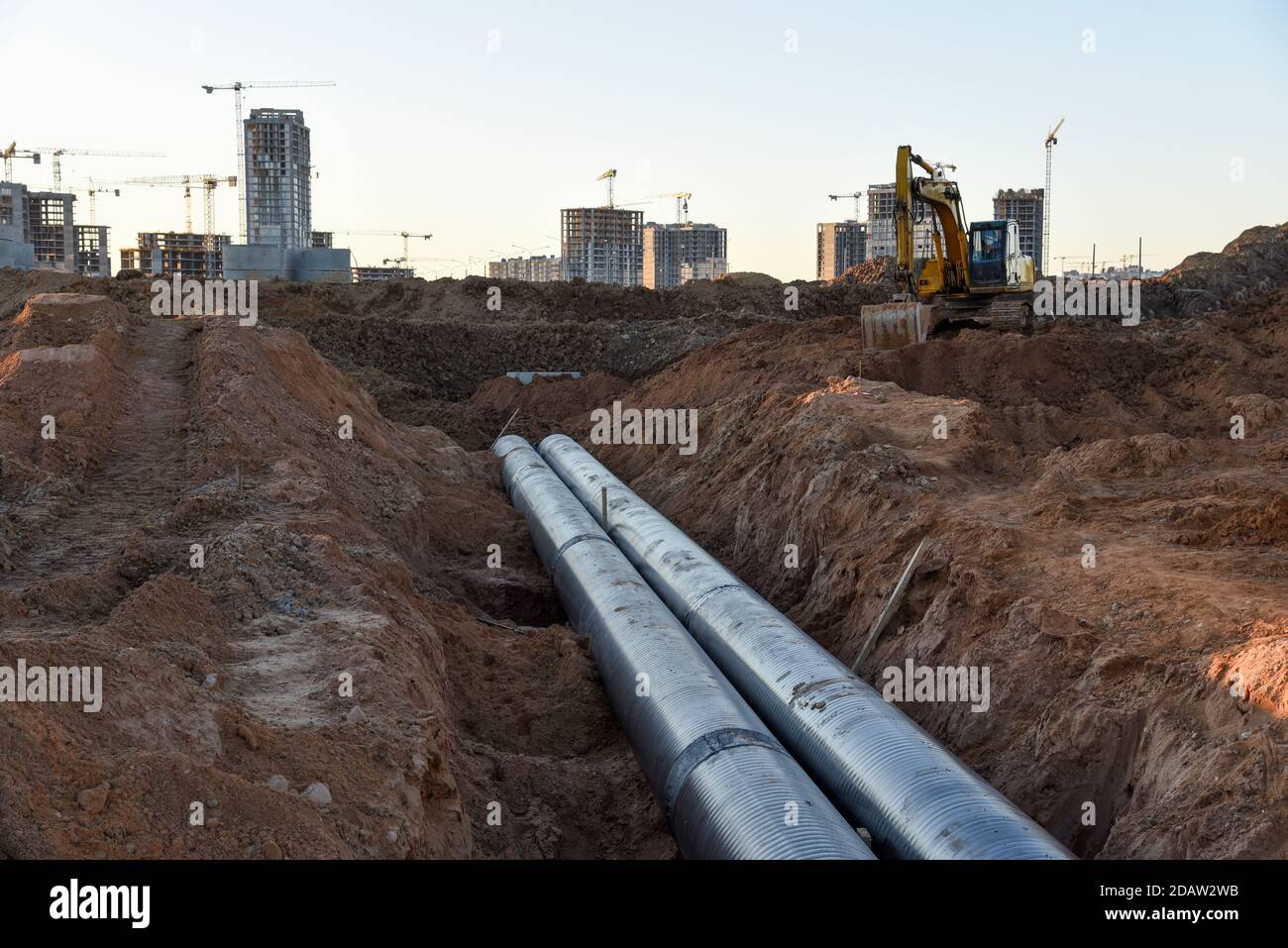 Excavator during construction of main water supply pipeline. Laying ...