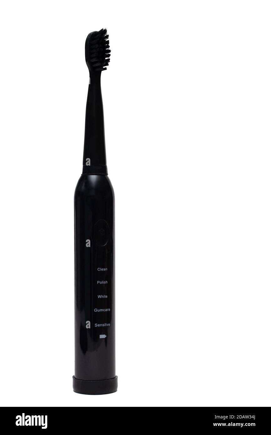 Black wireless electric toothbrush isolated on white background. Copy ...