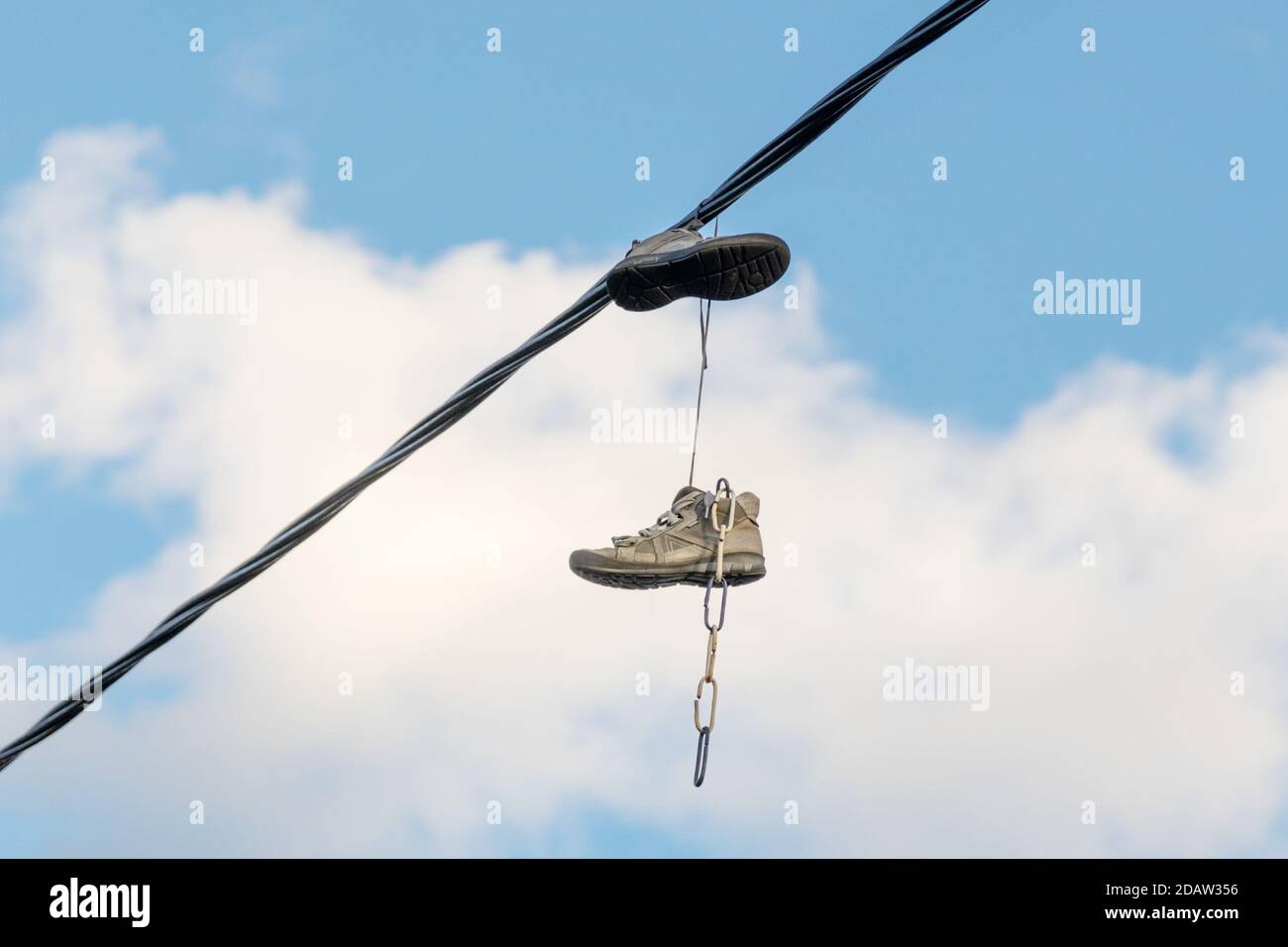 Boots hanging on wires hi-res stock photography and images - Alamy