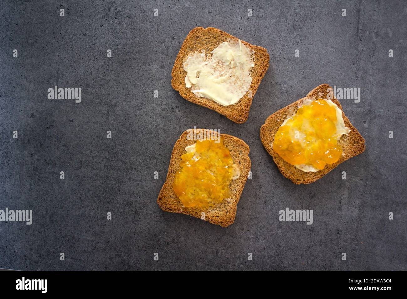 Sweet breakfast top view photo. Toasts with different toppings: peanut ...