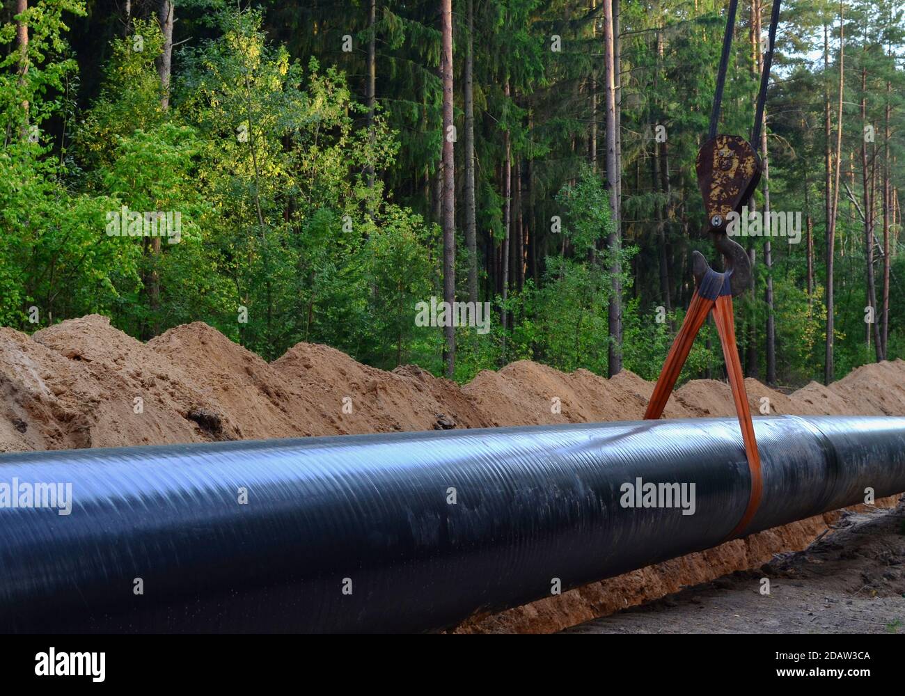 Natural gas pipeline construction work. A dug trench in the ground for ...
