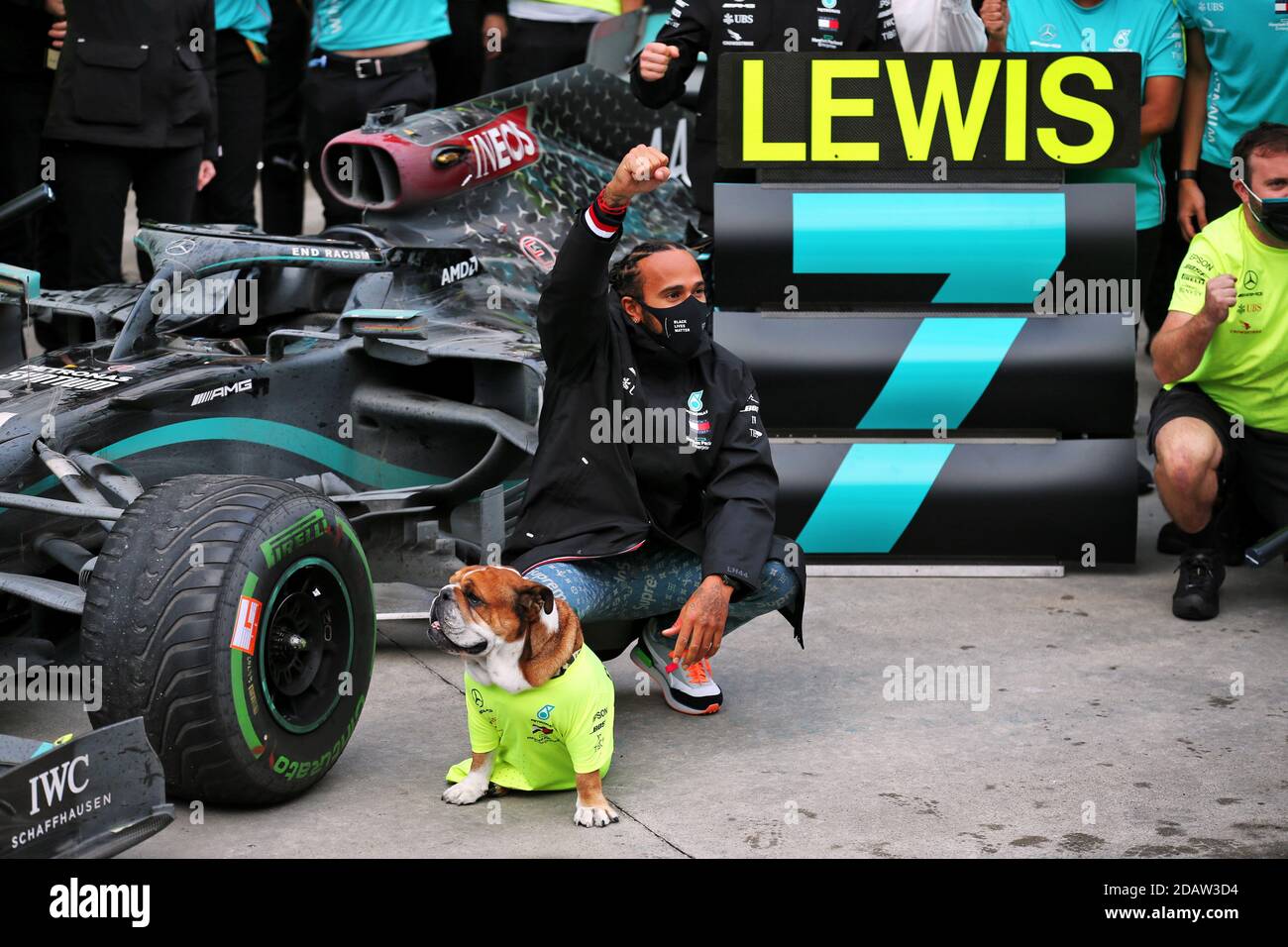 Mercedes AMG F1's Lewis Hamilton celebrates with his dog Roscoe after ...