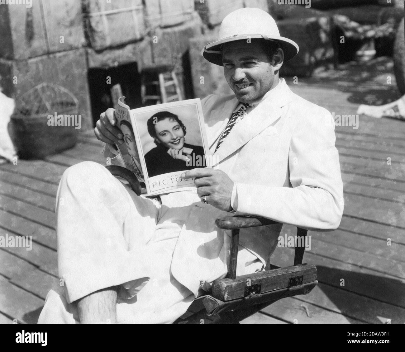 CLARK GABLE on set candid reading Screen Pictorial movie magazine ...
