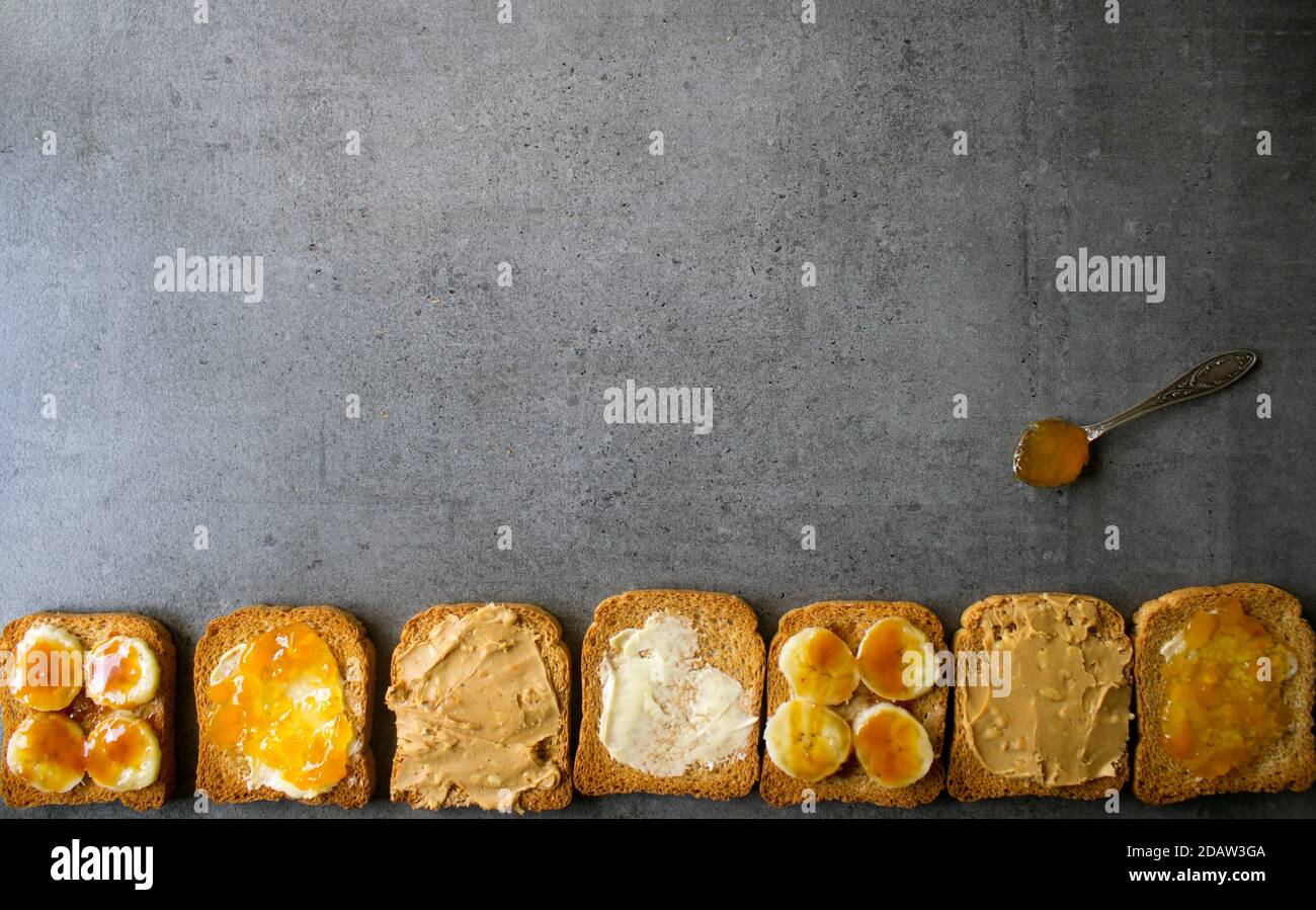 Frame or border made of toast bread with different toppings. Sweet ...