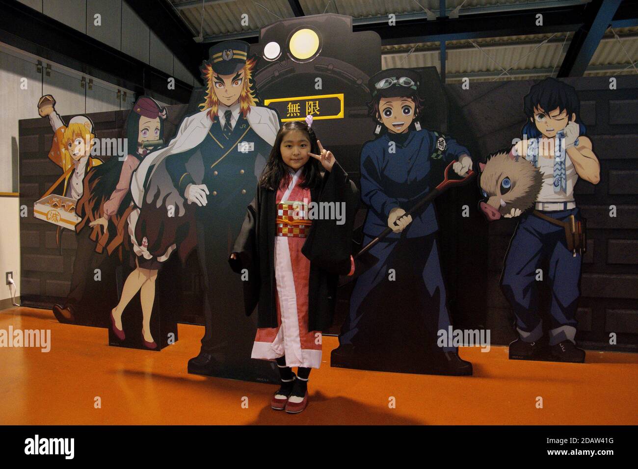 Annaka, Japan. 15th Nov, 2020. A girl wears character's costume of ...