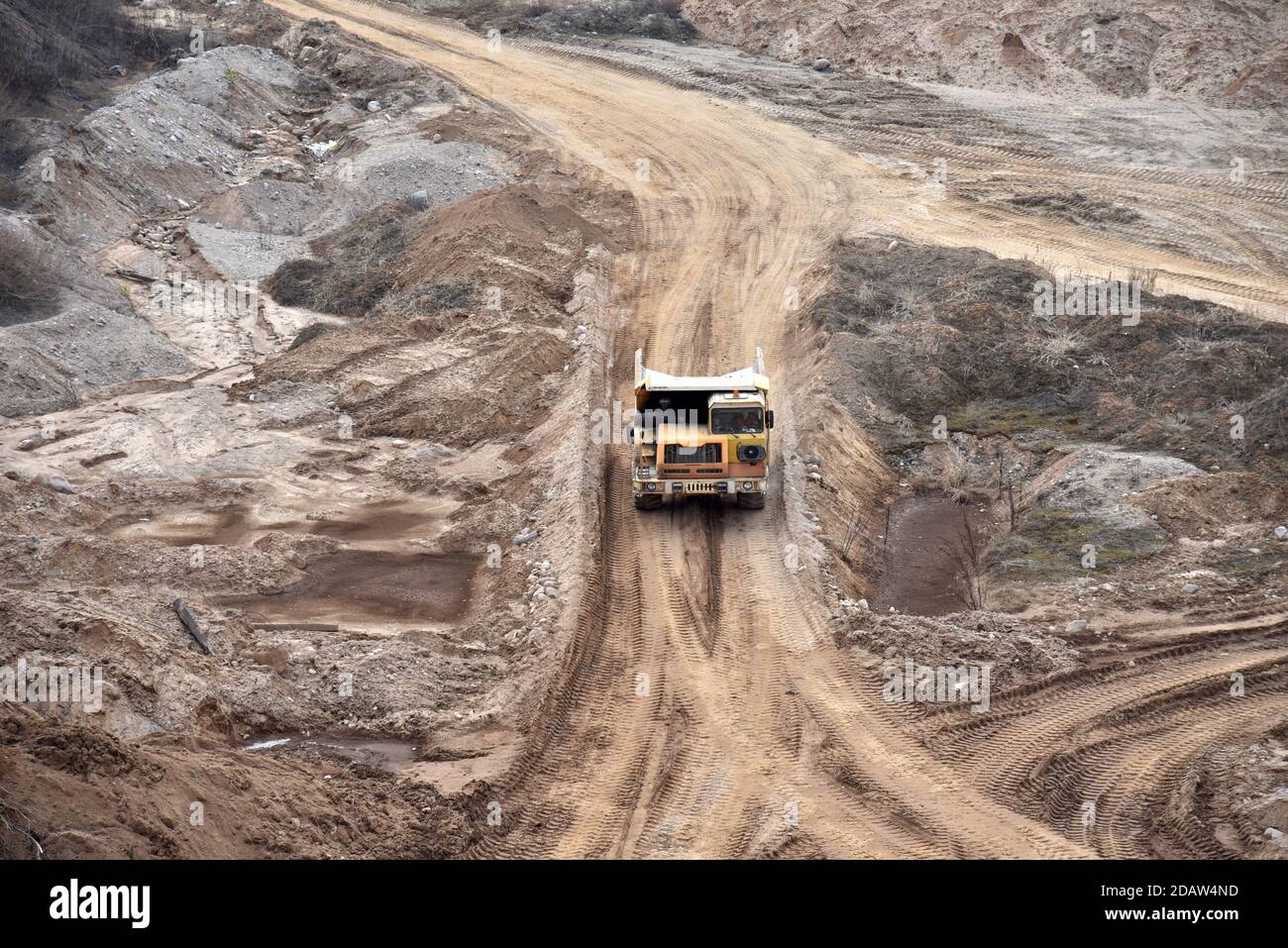 Mining truck transportion minerals and sand in the open-pit. Heavy ...