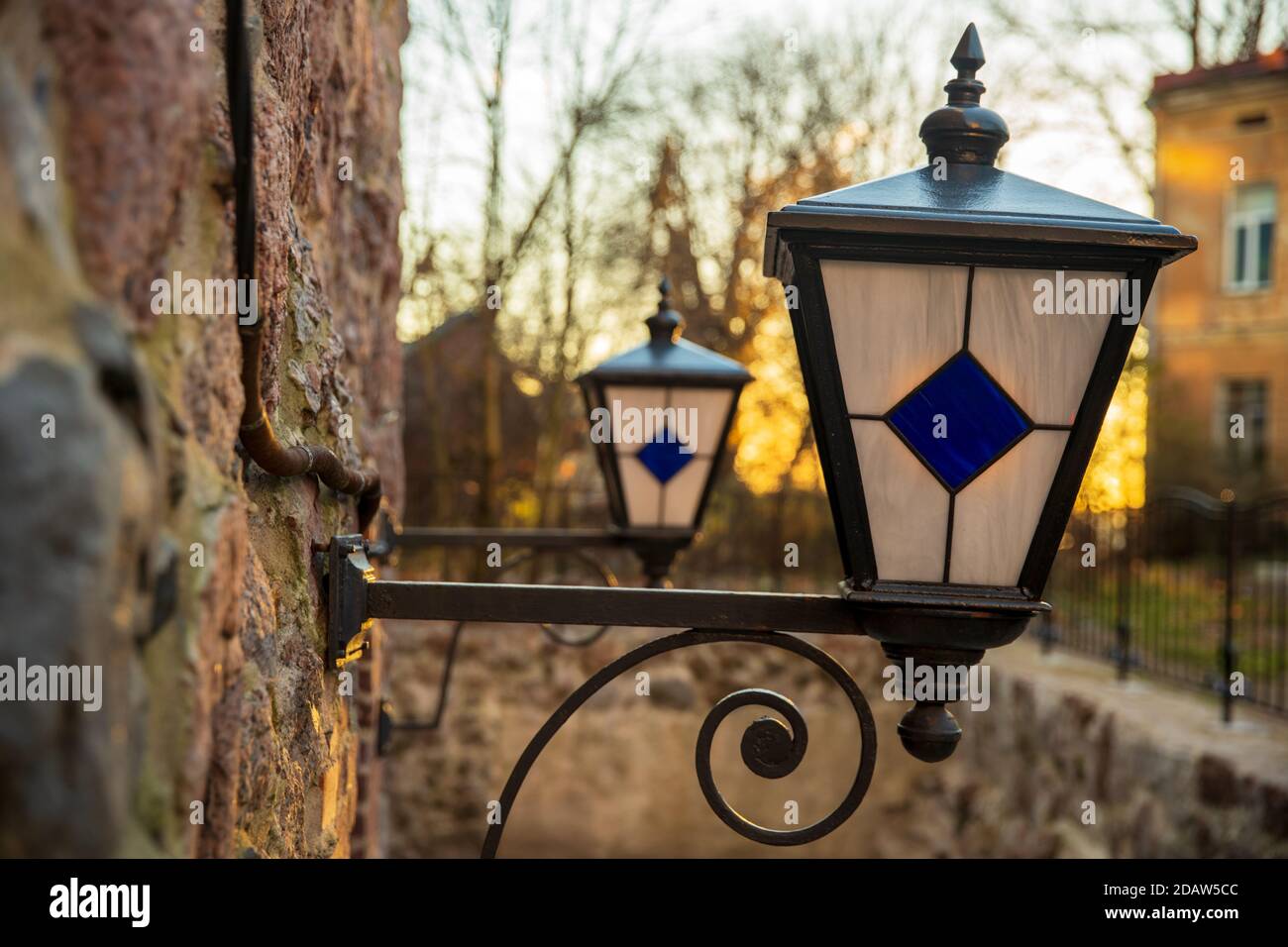beautiful street lights on the old house. evening old town Stock Photo ...