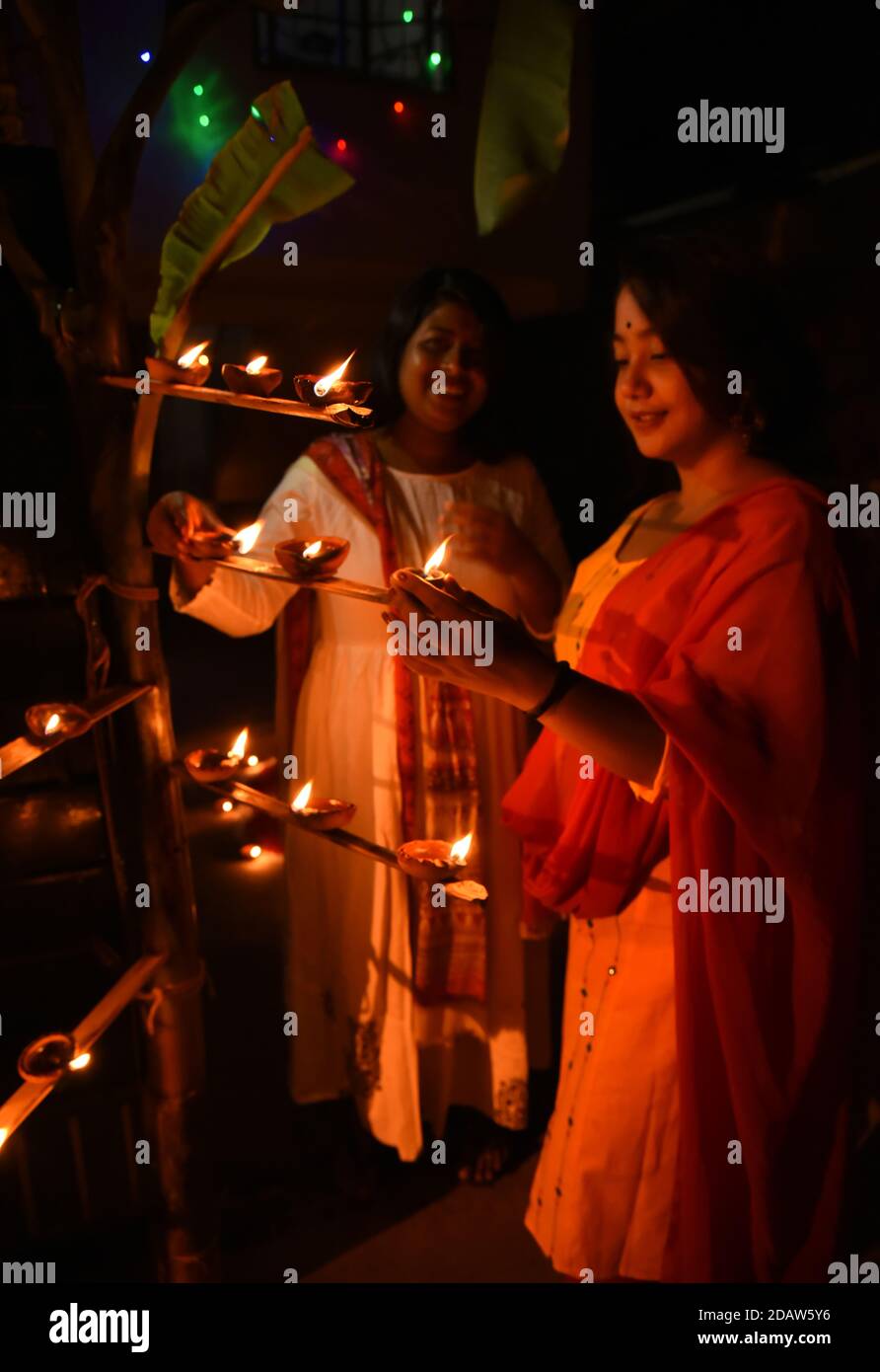 Guwahati, Assam, India. 15th Nov, 2020. Assamese women light earthen ...