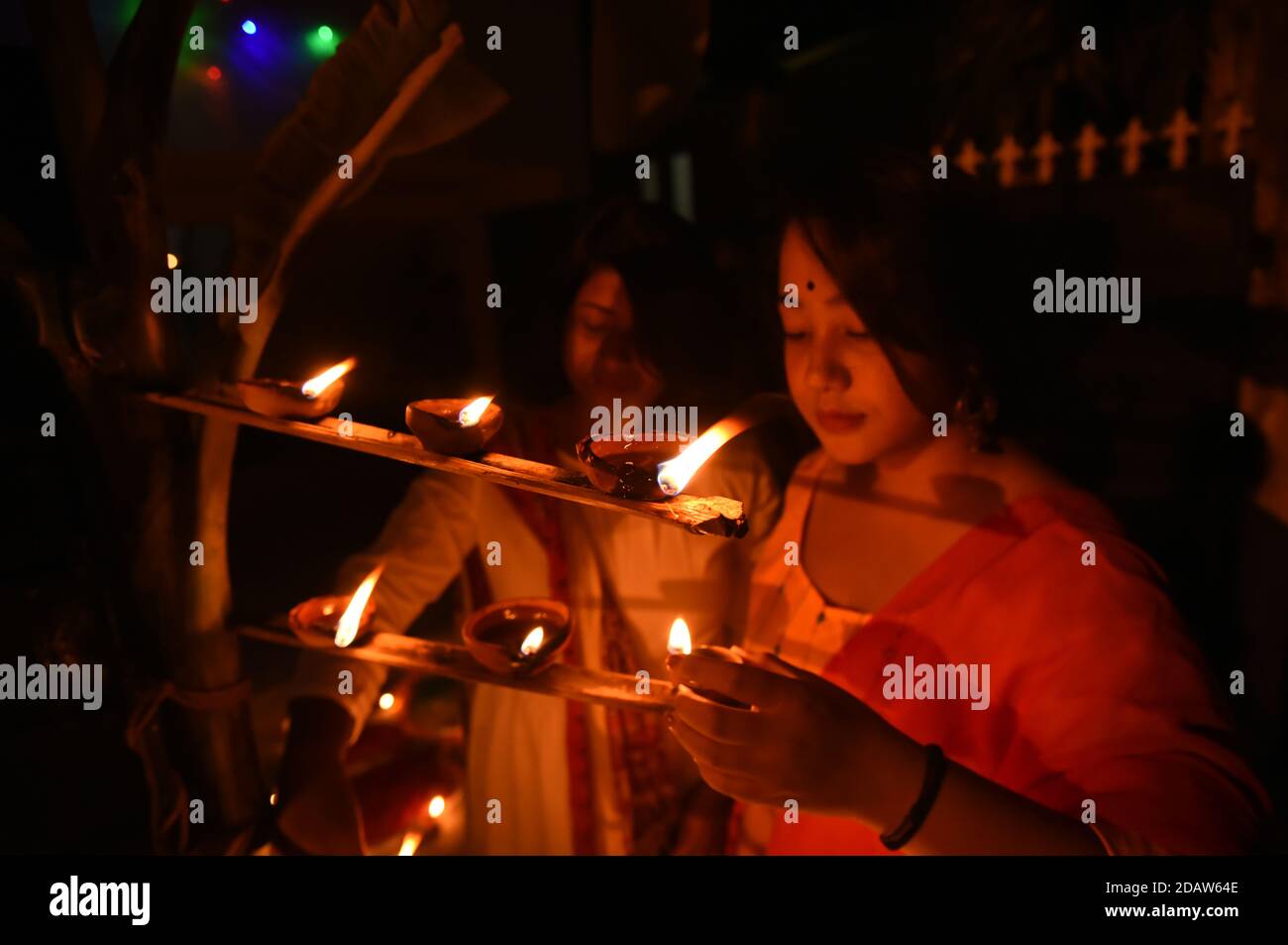 Guwahati, Assam, India. 15th Nov, 2020. Assamese women light earthen ...