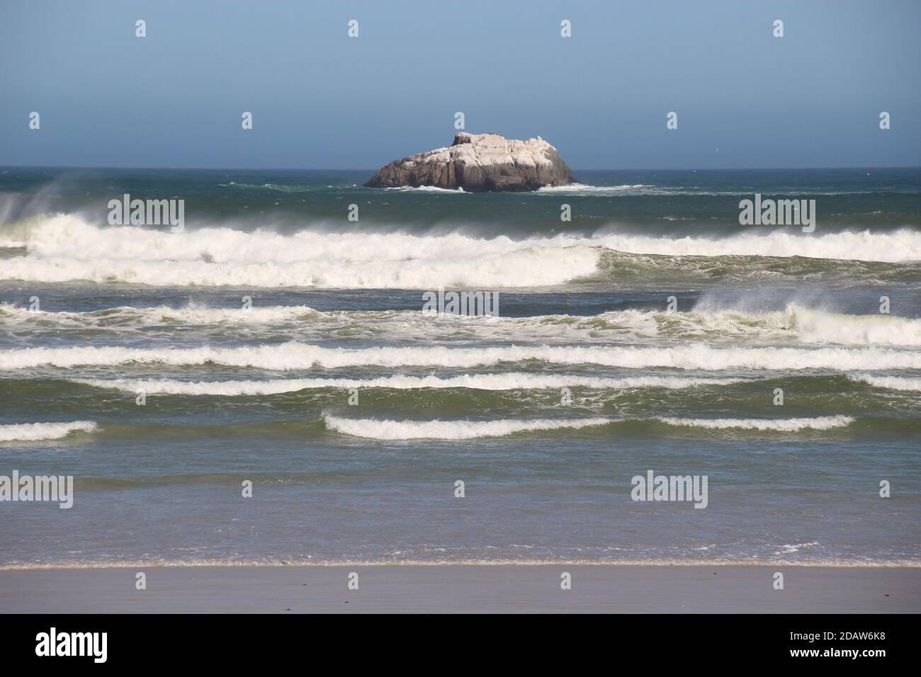 On the shore of the wild atlantic ocean in Yzerfontein, Rocks and surf ...