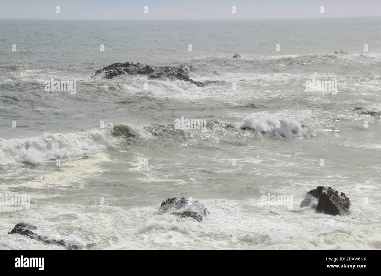 On the shore of the wild atlantic ocean in Yzerfontein, Rocks and surf ...