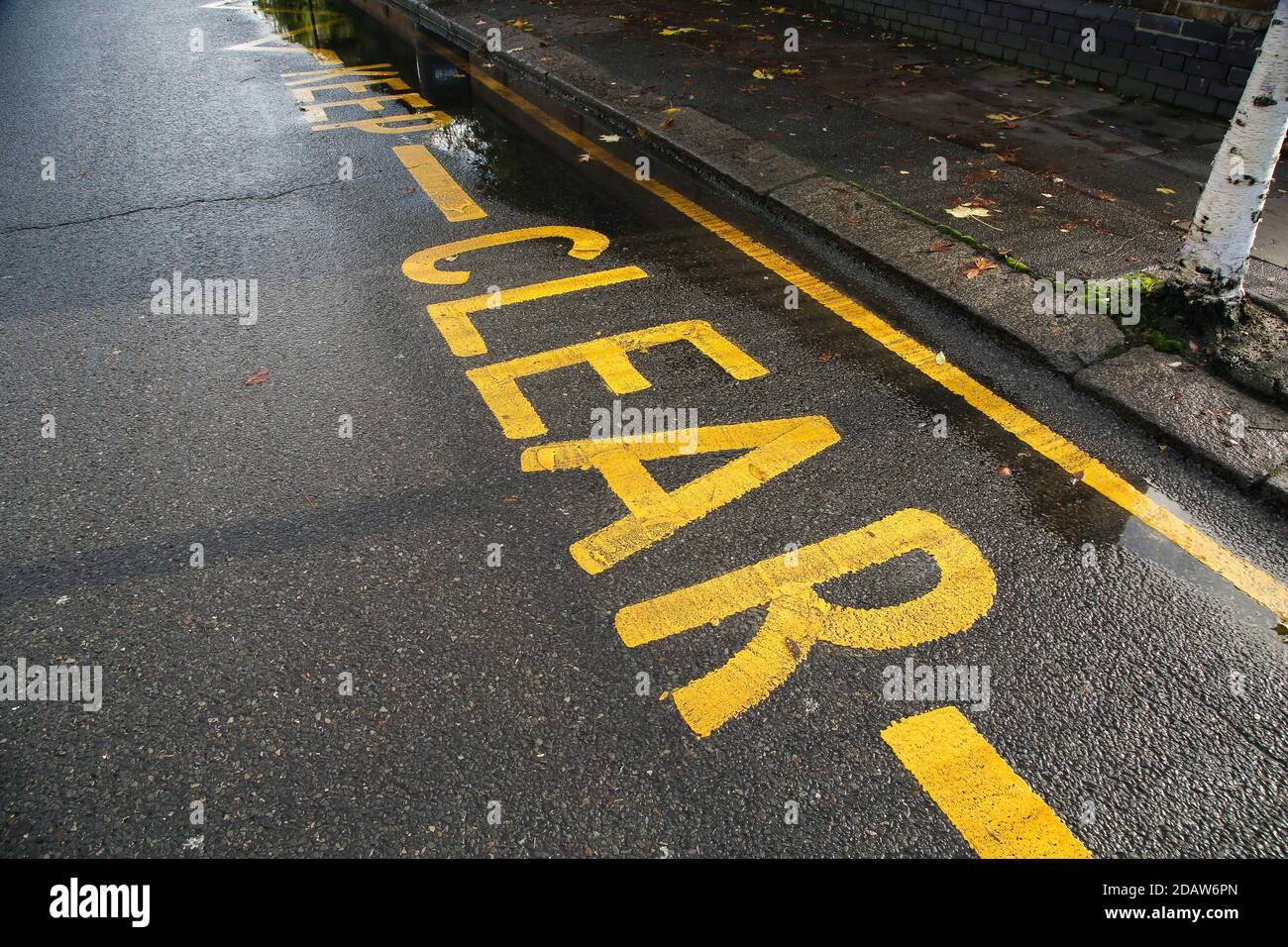 A 'Keep Clear' road marking seen on a road in London Stock Photo - Alamy