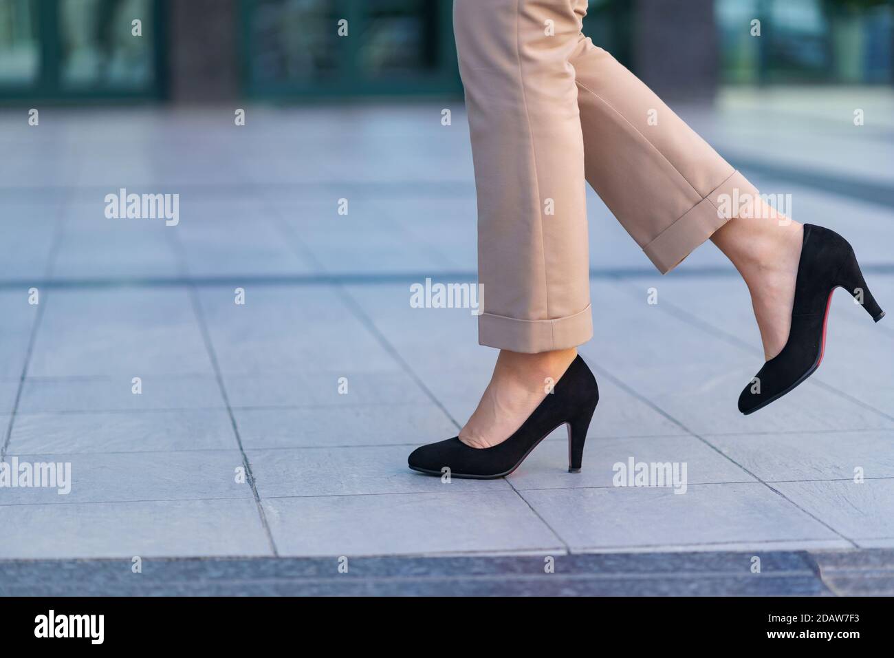 Woman wearing classic black high heel toe shoes. Model posing on the ...