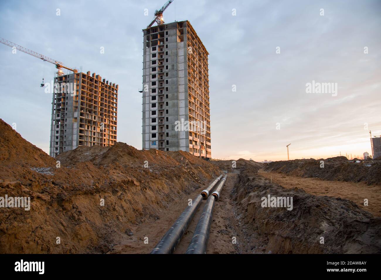 Drainage pipes at the large scale construction site against tower ...