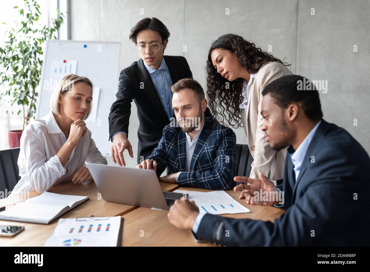 United Business Team Working Together At Laptop In Modern Office Stock ...