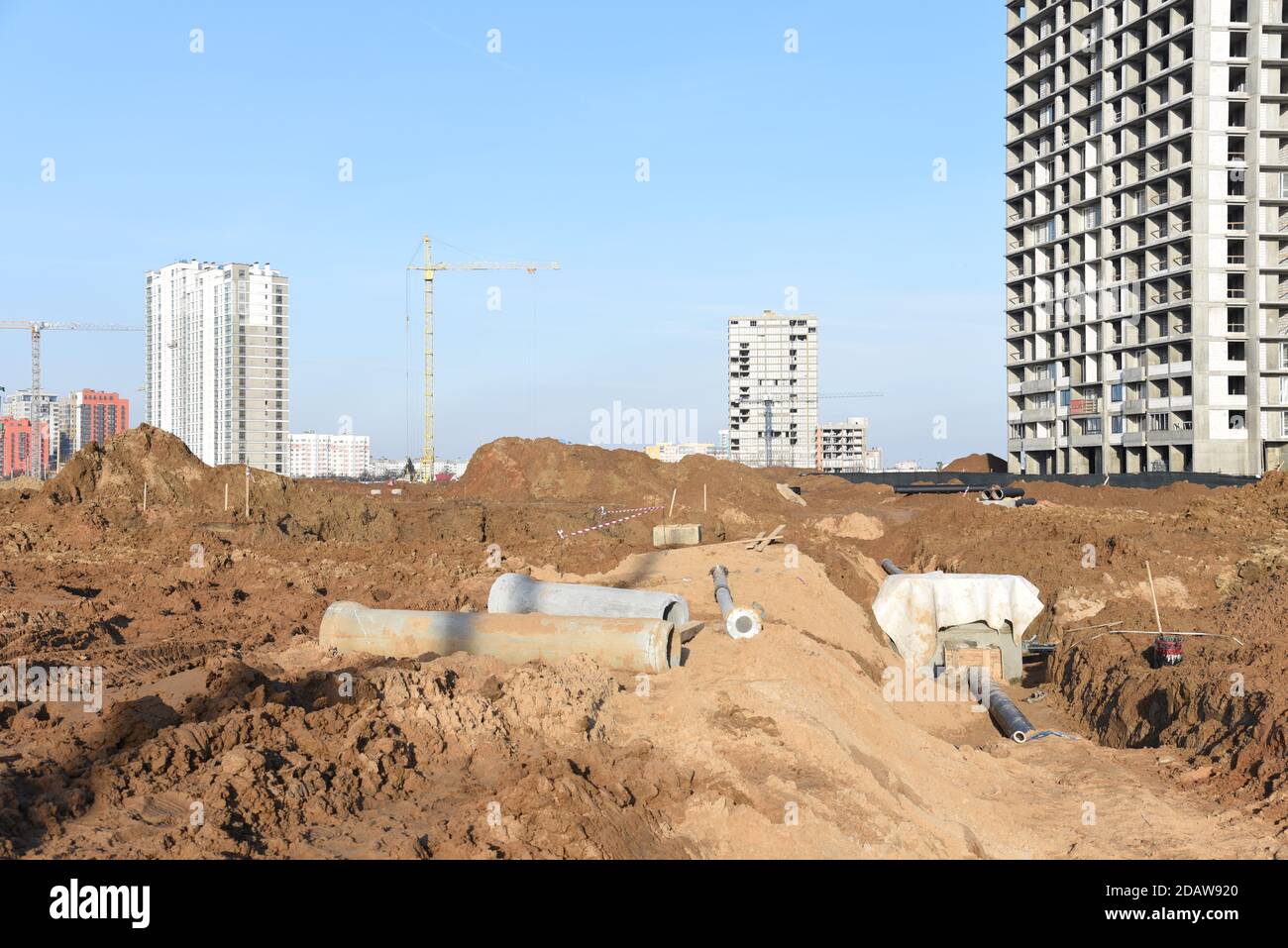 Tower cranes constructing a new residential build. Laying or ...
