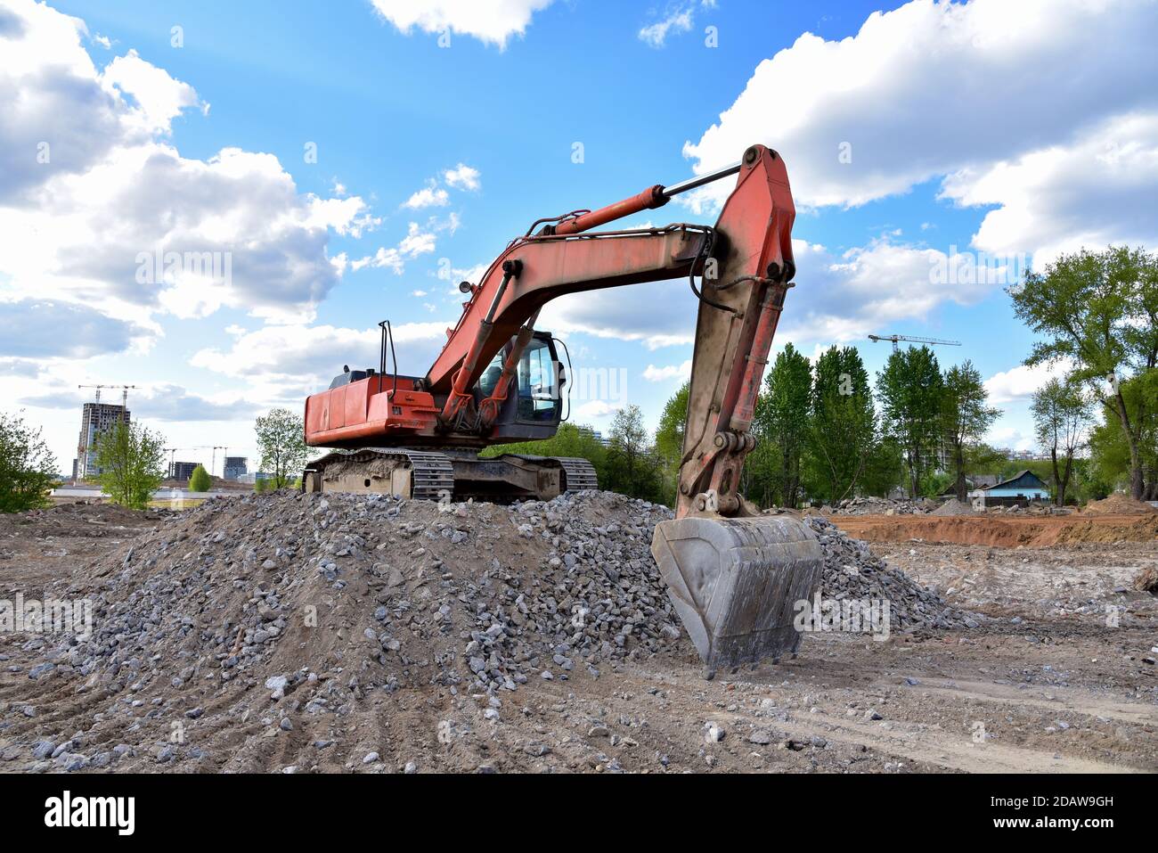 Excavator work at landfill with concrete demolition waste. Salvaging ...
