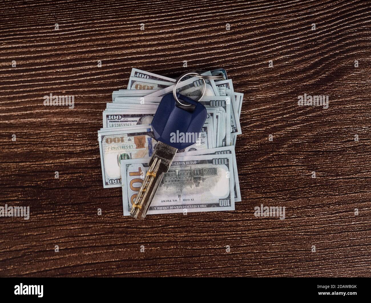 keys next to artificial dollar bills, buy your own home or car, open ...