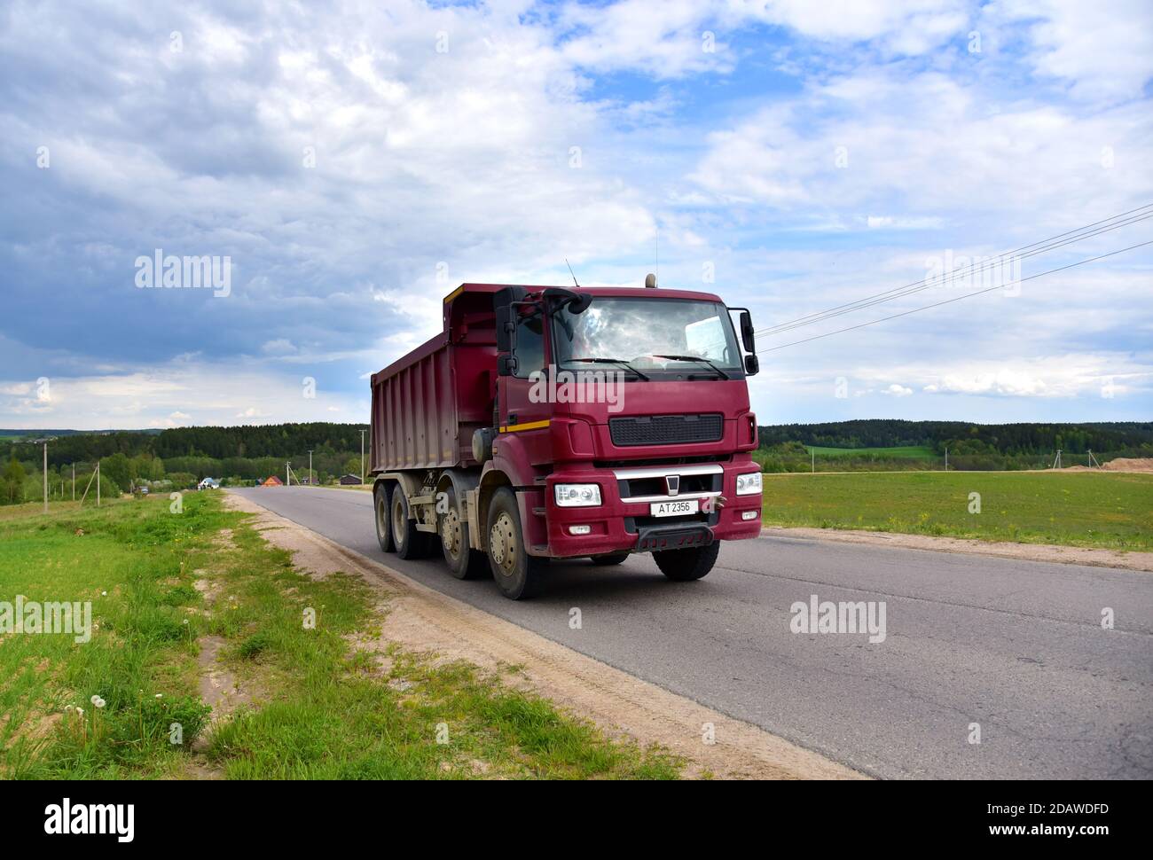 Tipper Dump Truck transported sand from the quarry on driving along ...