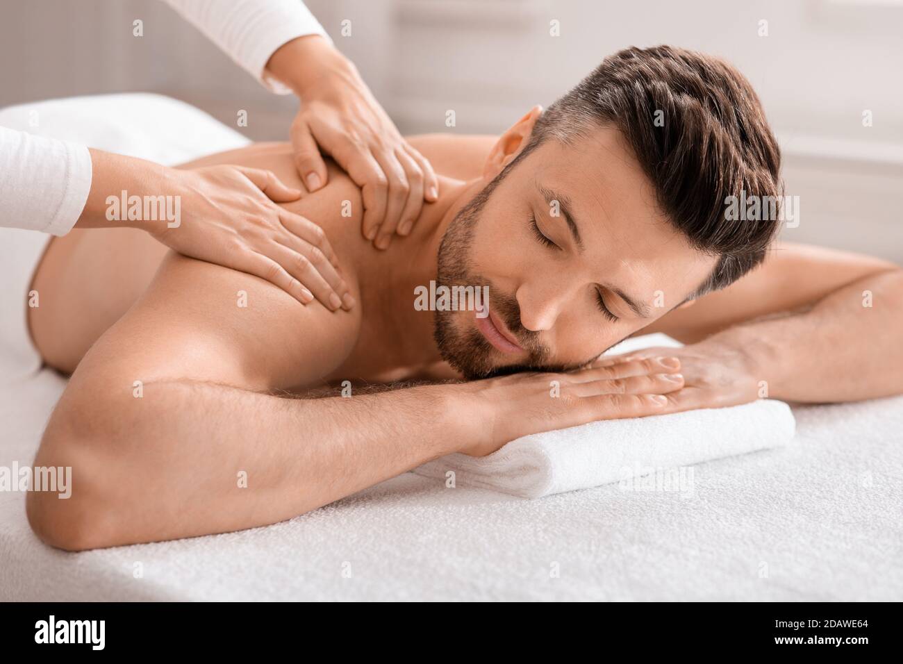 Closeup of relaxed man having body massage at spa Stock Photo Alamy