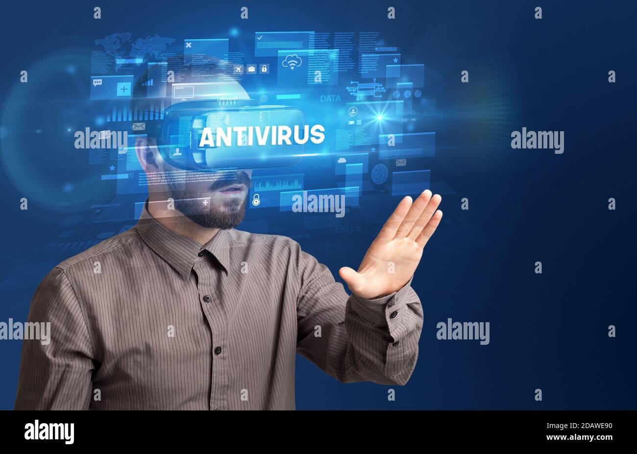 Businessman looking through Virtual Reality glasses with ANTIVIRUS ...