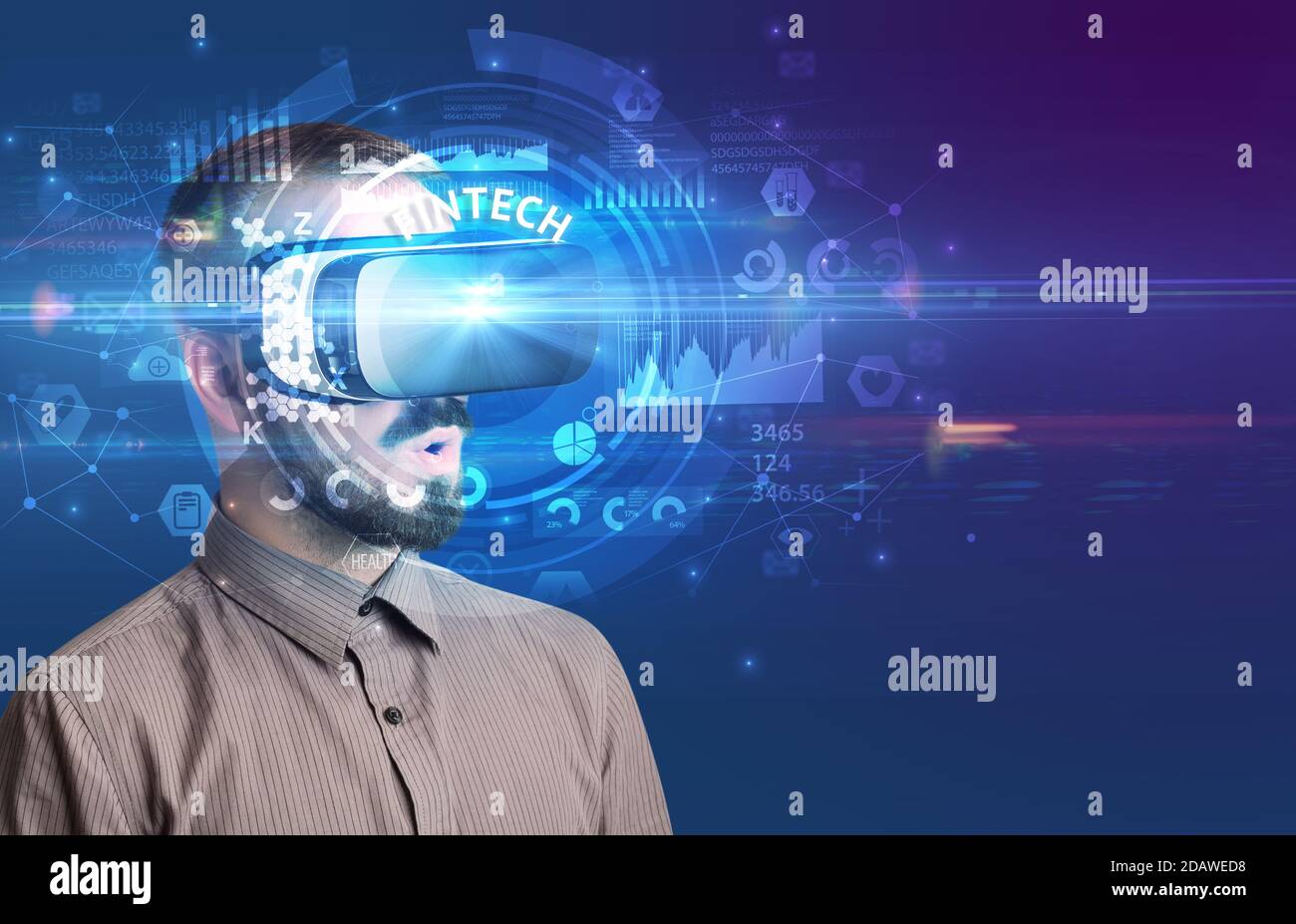 Businessman looking through Virtual Reality glasses with FINTECH ...