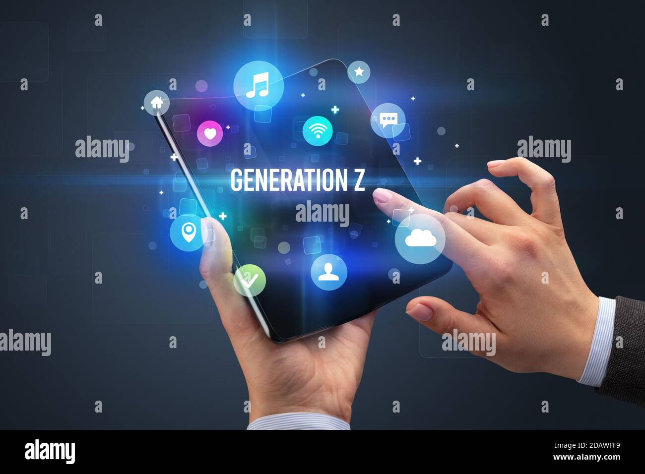 Businessman holding a foldable smartphone with GENERATION Z inscription ...
