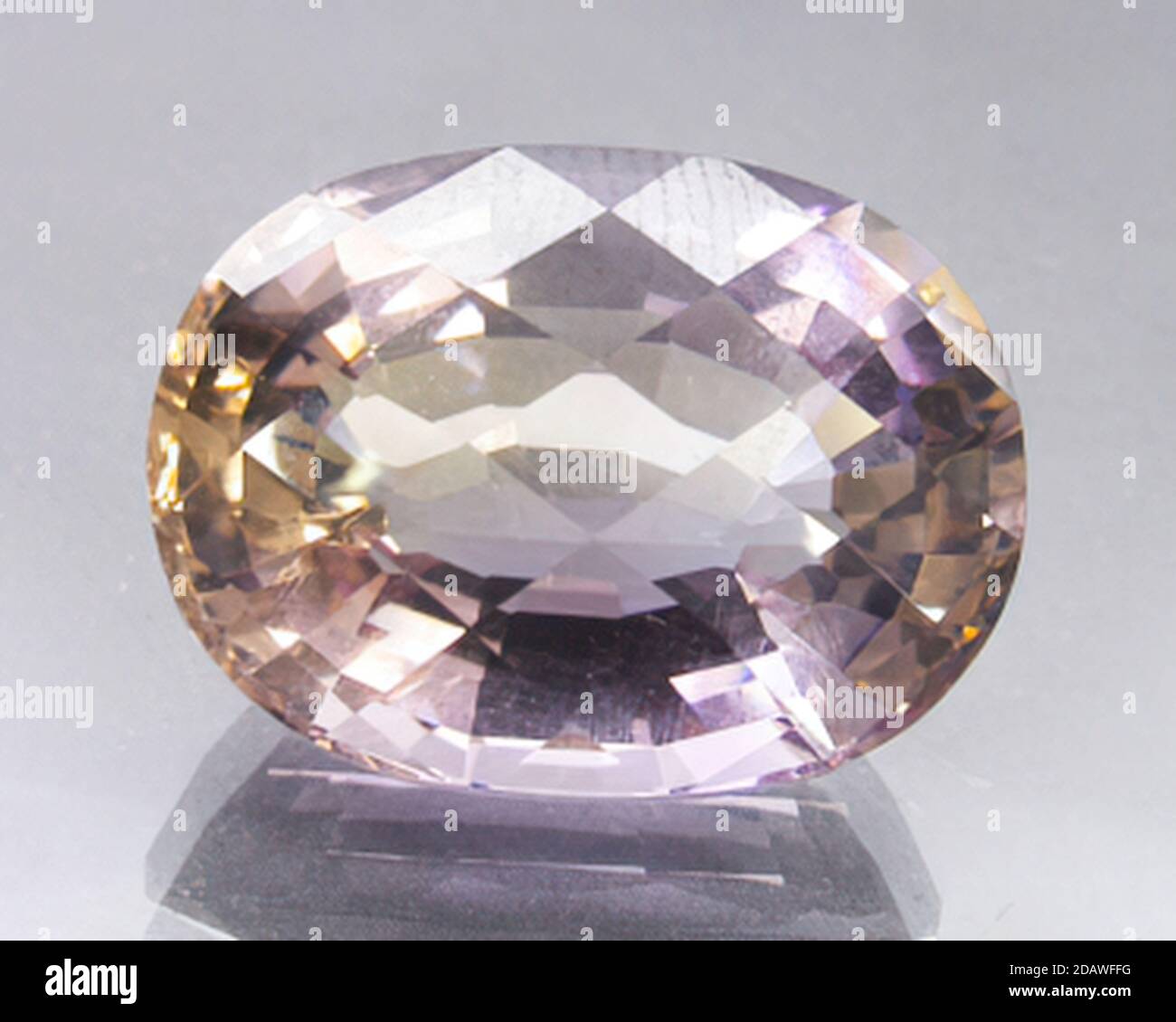 Natural amethyst on gray background Stock Photo - Alamy