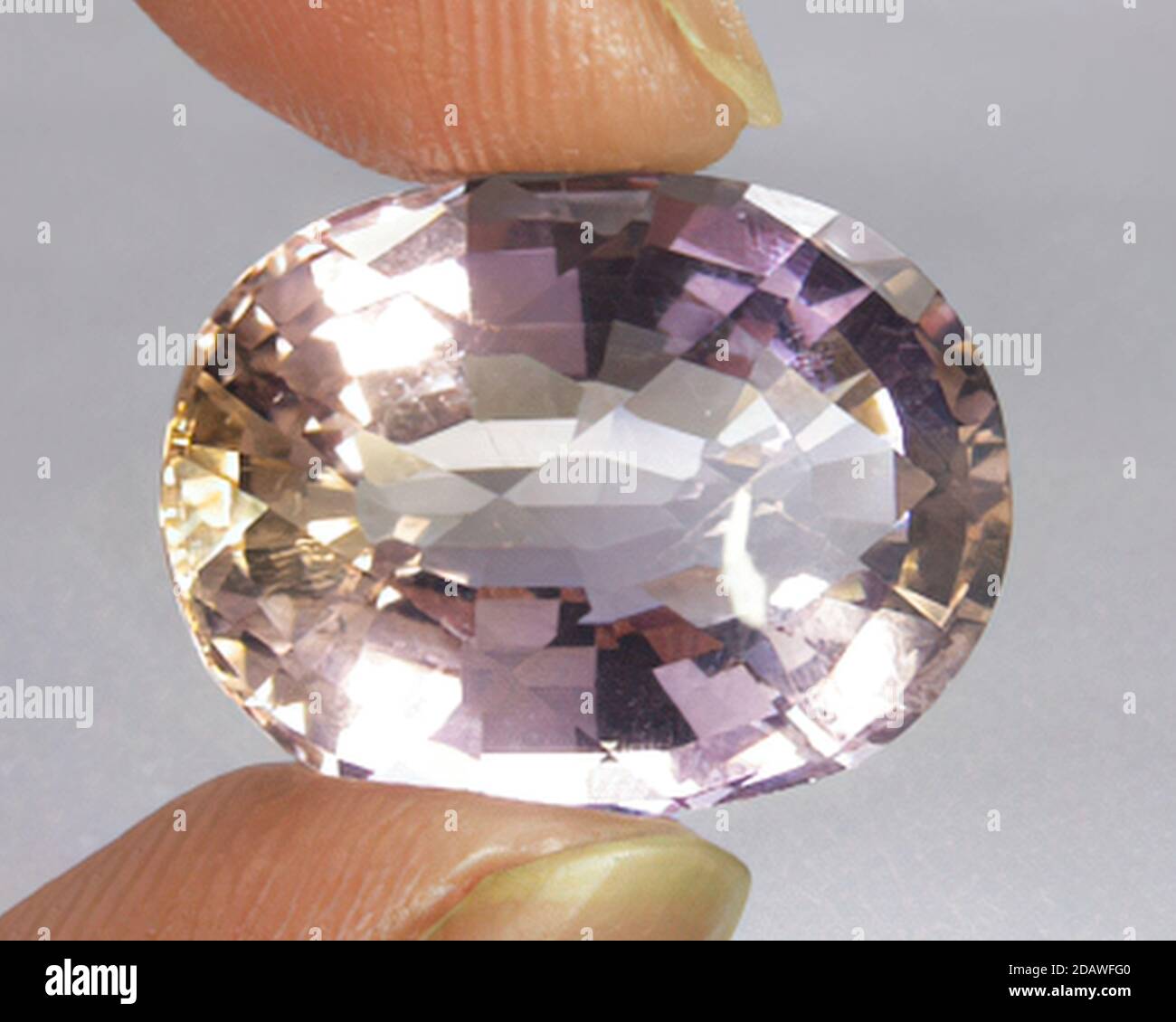 Natural amethyst on gray background Stock Photo - Alamy